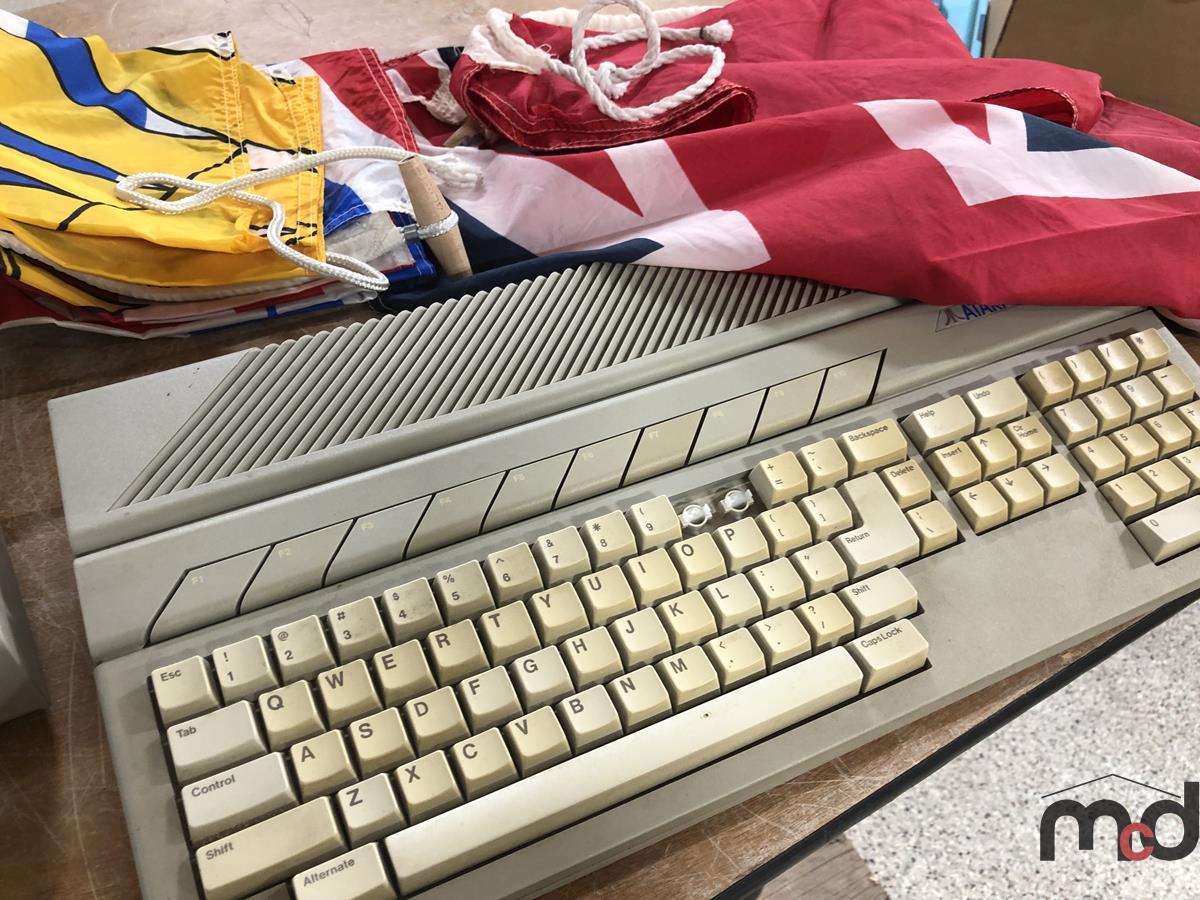 Atari Parts, Track Balls, Floppy Drive, Keyboard, (2) Flags, and Game
