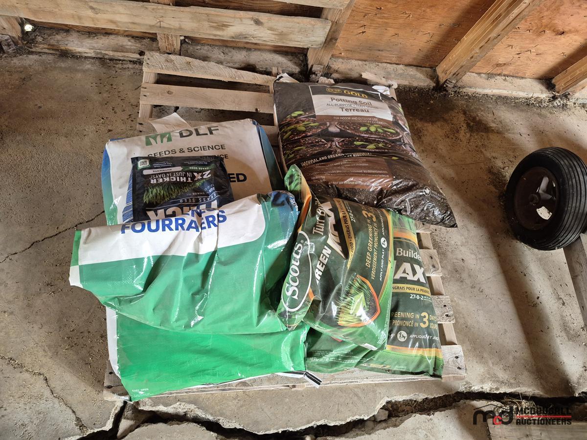 Assorted Spreaders and Pallet of Grass Seed and Soil